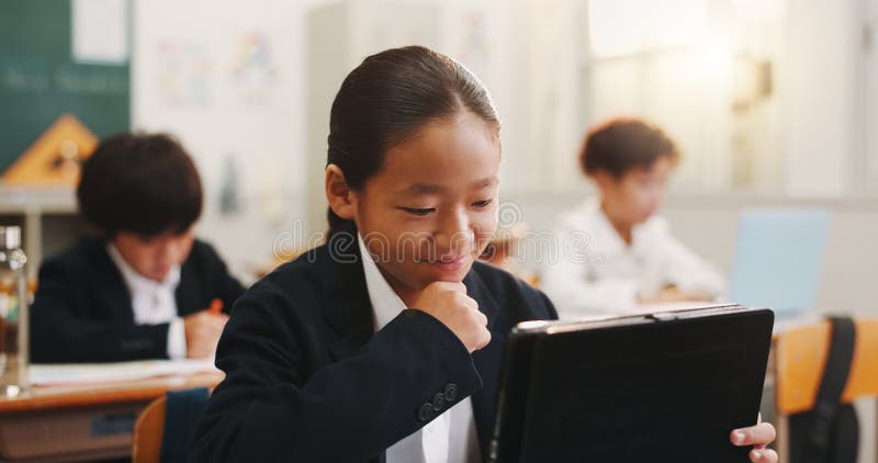 Boy, Tablet and Reading in Classroom with Smile, Education or E ...