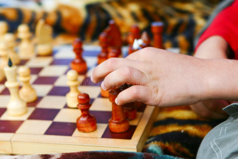 Boy takes a chess rook stock image. Image of family, leader - 91696383