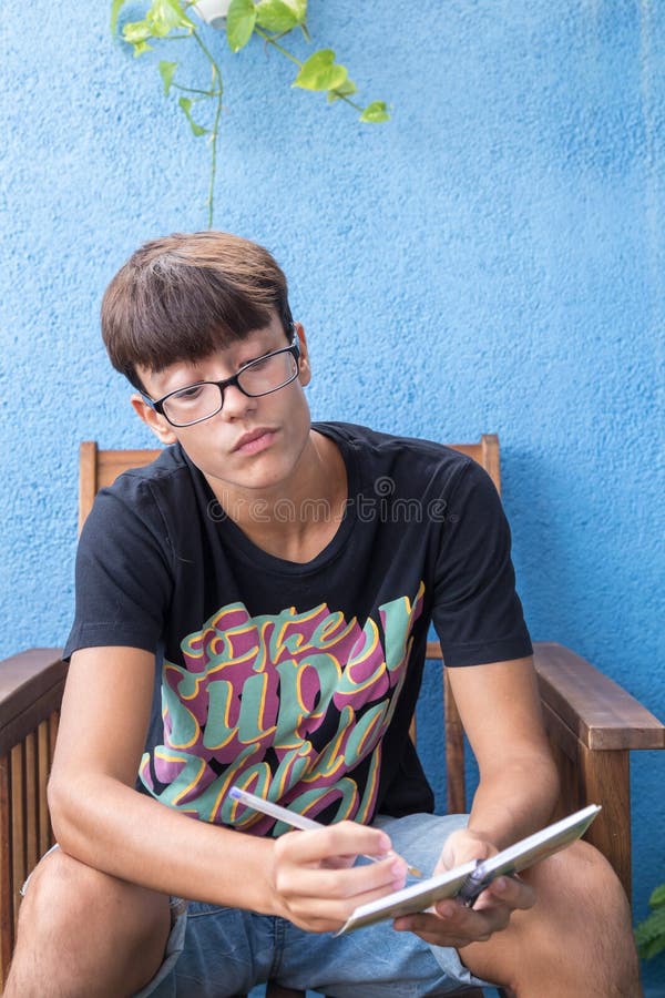 The Boy Takes Notes in Notepad Stock Image - Image of caucasian, young ...