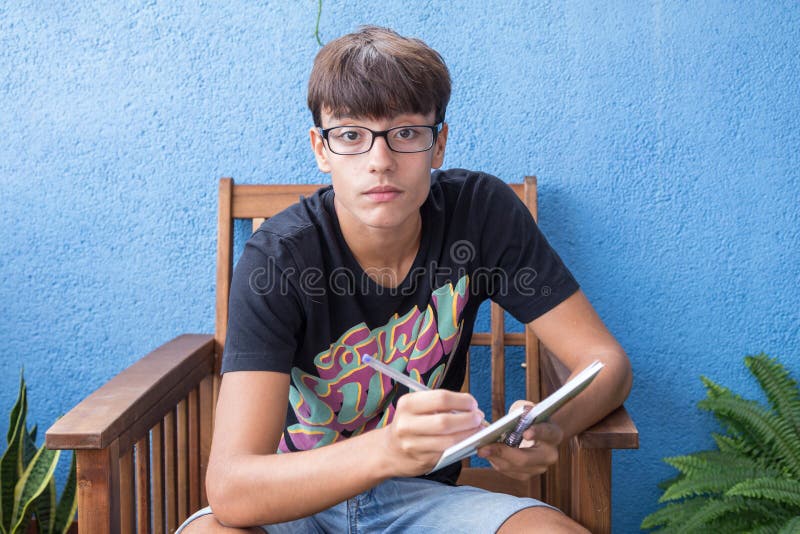 The Boy Takes Notes in Notepad Stock Image - Image of caucasian, young ...