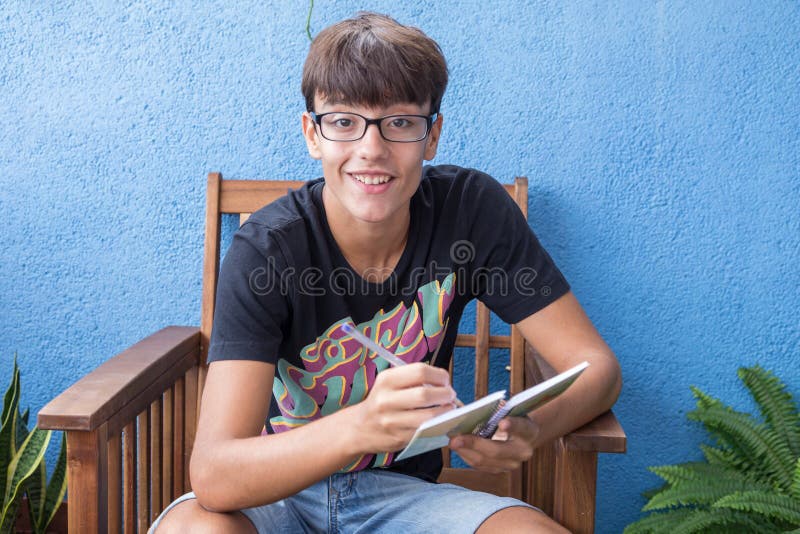 The Boy Takes Notes in Notepad Stock Image - Image of hair, european ...