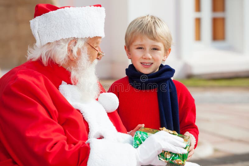 Boy Taking Present from Santa Claus Stock Image - Image of nicholas ...
