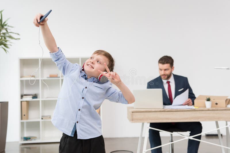 Boy Taking Self Portrait while His Father Businessman Stock Image ...