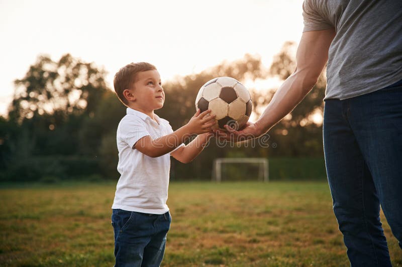 Boy is Taking Soccer Ball. Father and Little Son are Playing and Having ...