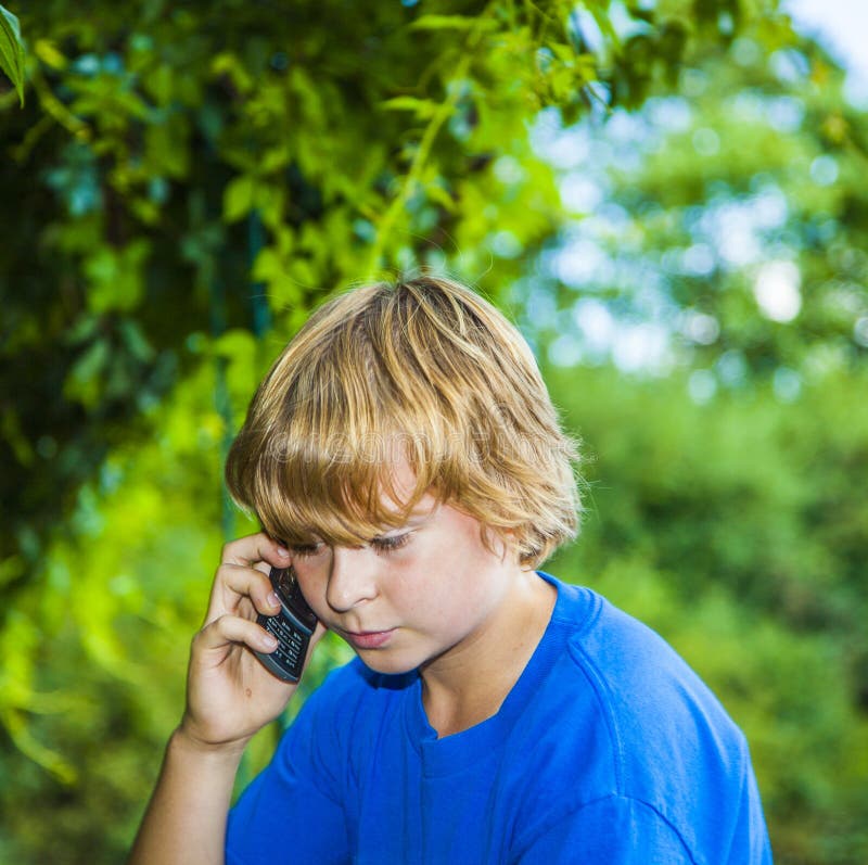 Boy Talking on a Cell Phone. Stock Photo - Image of discussion ...