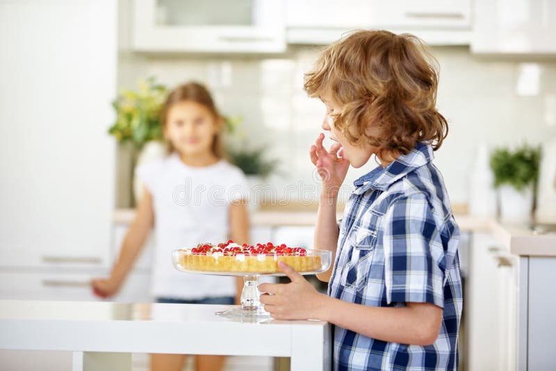 Boy Tasting from Fruit Cake with Currants Stock Photo - Image of ...