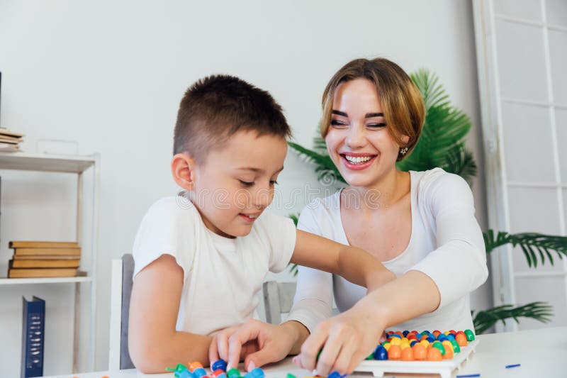 A Boy with a Teacher is Engaged in the Development of Learning in the ...