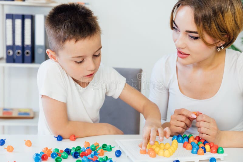 A Boy with a Teacher is Engaged in the Development of Learning in the ...