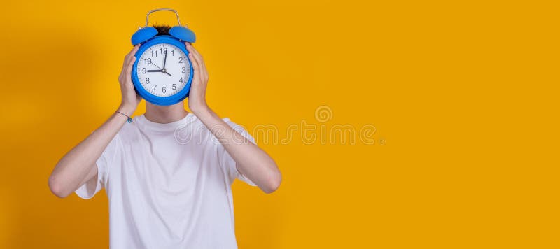 Boy or Teenager with Clock in Front of Face Stock Photo - Image of teen ...
