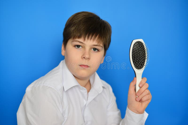 Boy Teenager with Comb in His Hand Stock Photo - Image of juvenile ...