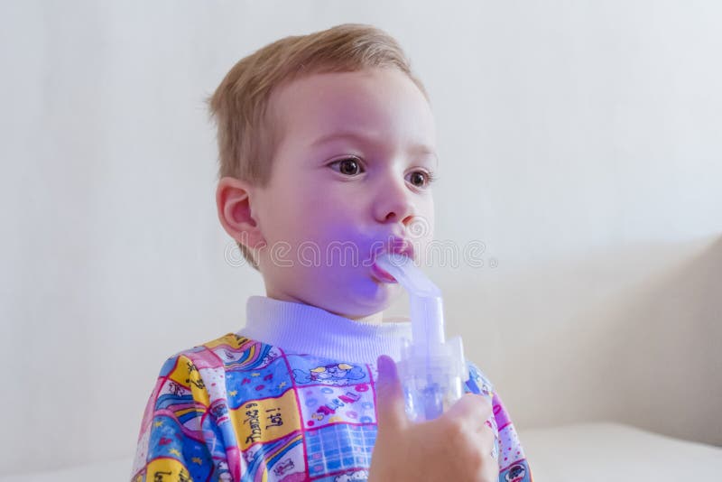 Boy Therapeutic Inhalation Using a Nebulizer Stock Photo - Image of ...