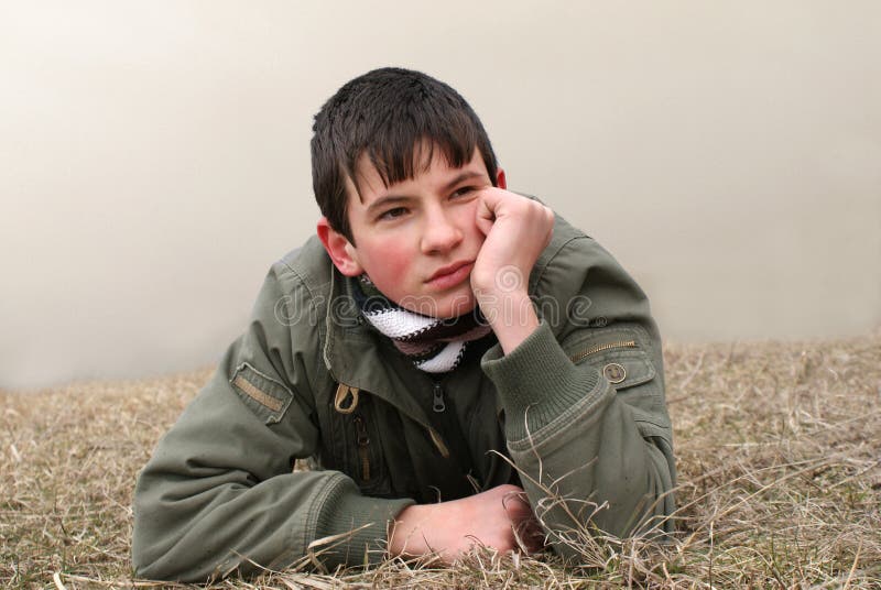 Sad boy thinking stock photo. Image of laying, unhappy - 19065070