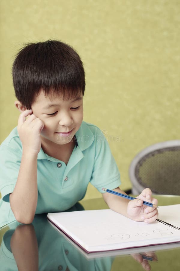 Boy Thinking while Doing Homework. Conceptual Image Stock Image - Image ...