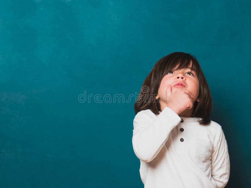 Boy Thinking in Front of the Classroom Blackboard. Stock Image - Image ...