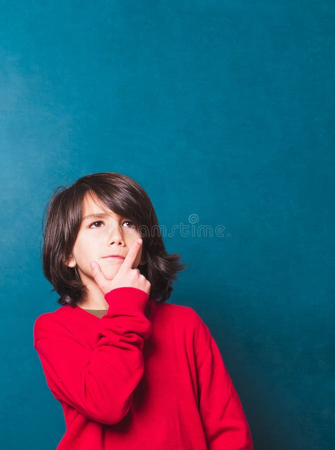 Boy Thinking in Front of the Classroom Blackboard. Stock Image - Image ...