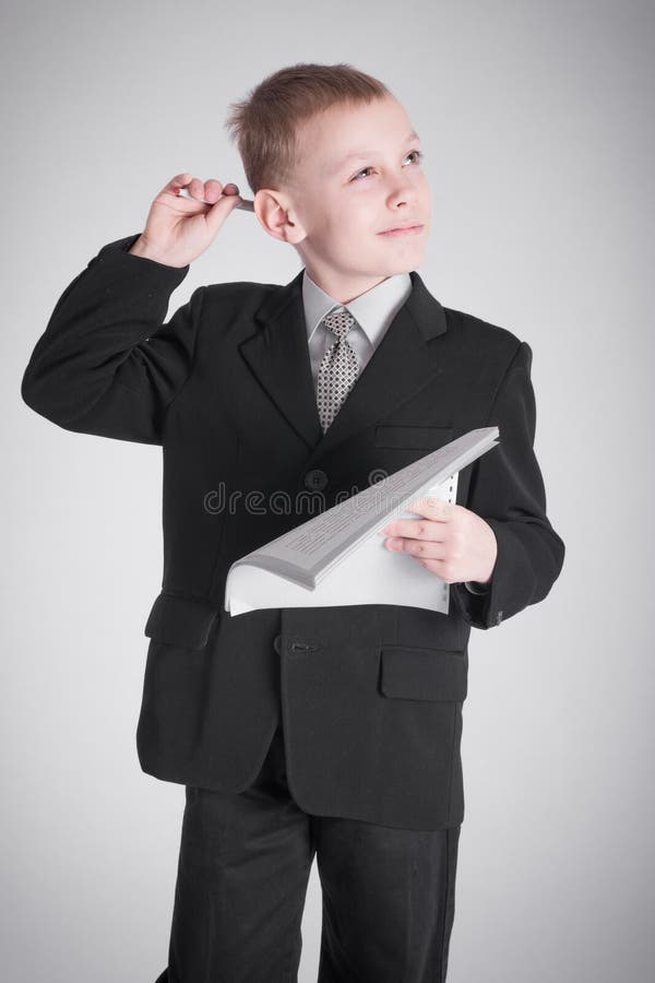 Boy with a thoughtful look stock photo. Image of think - 30601292