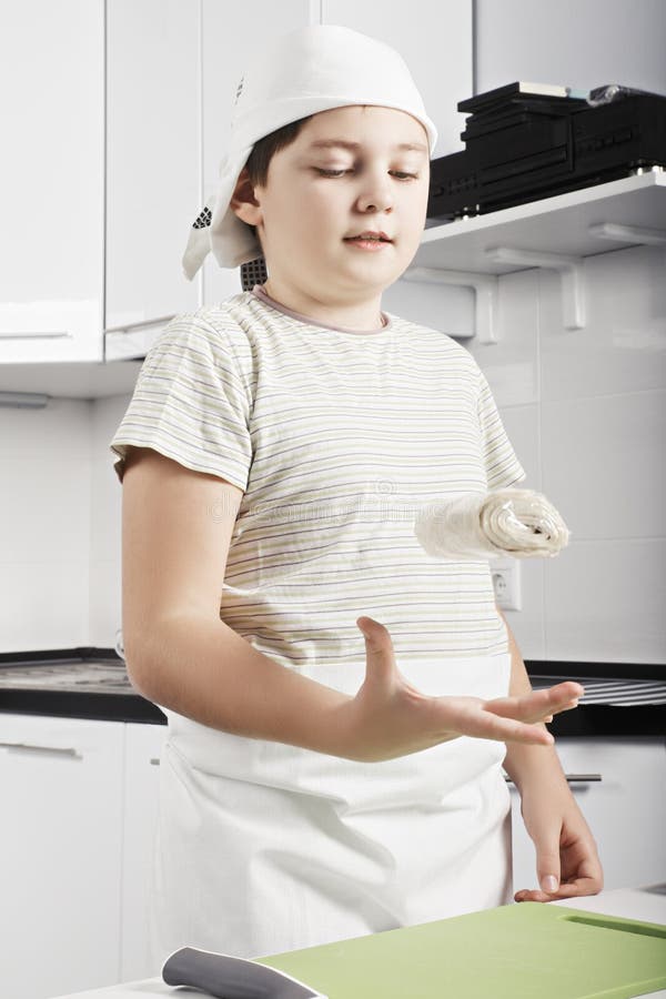 Boy throwing dough up stock photo. Image of dough, people - 63451714