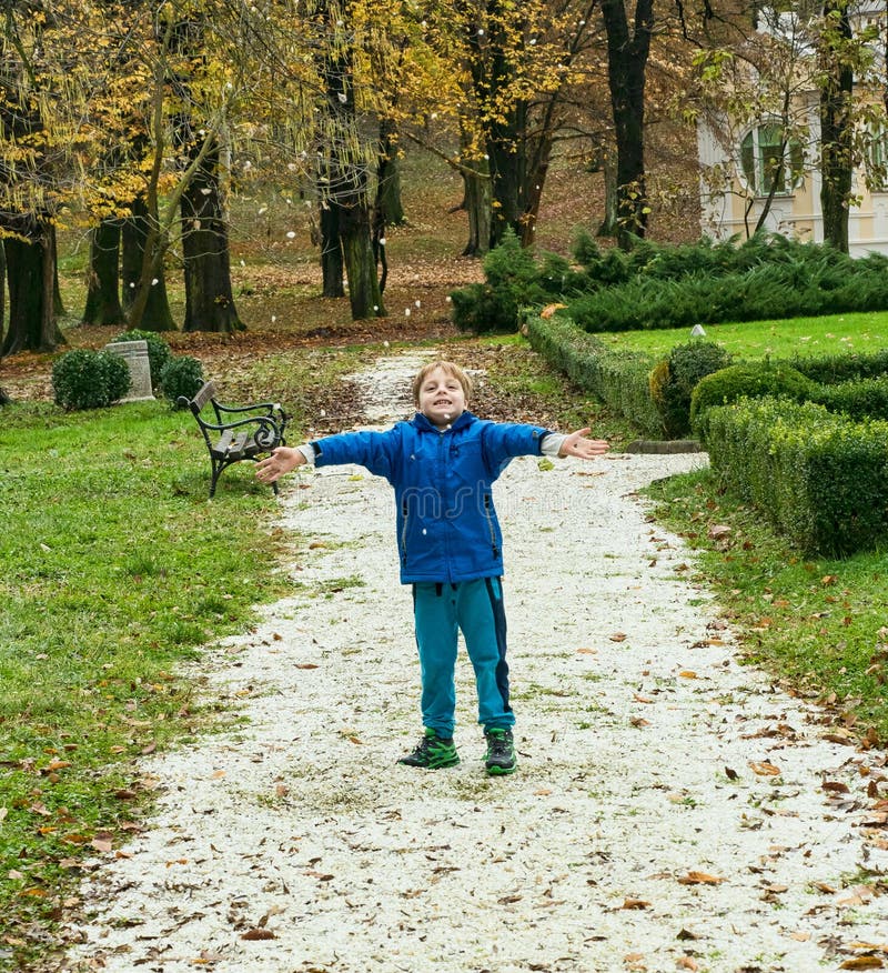 Boy throwing pebbles stock photo. Image of happiness - 81324462