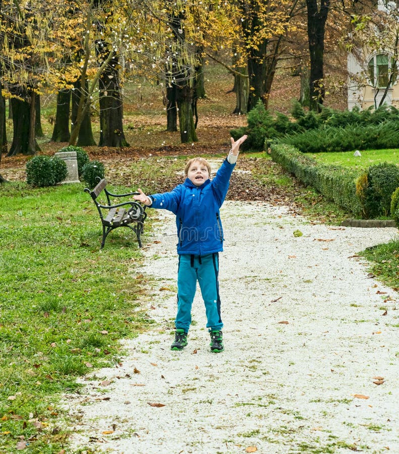 Boy throwing pebbles stock photo. Image of happiness - 81324462