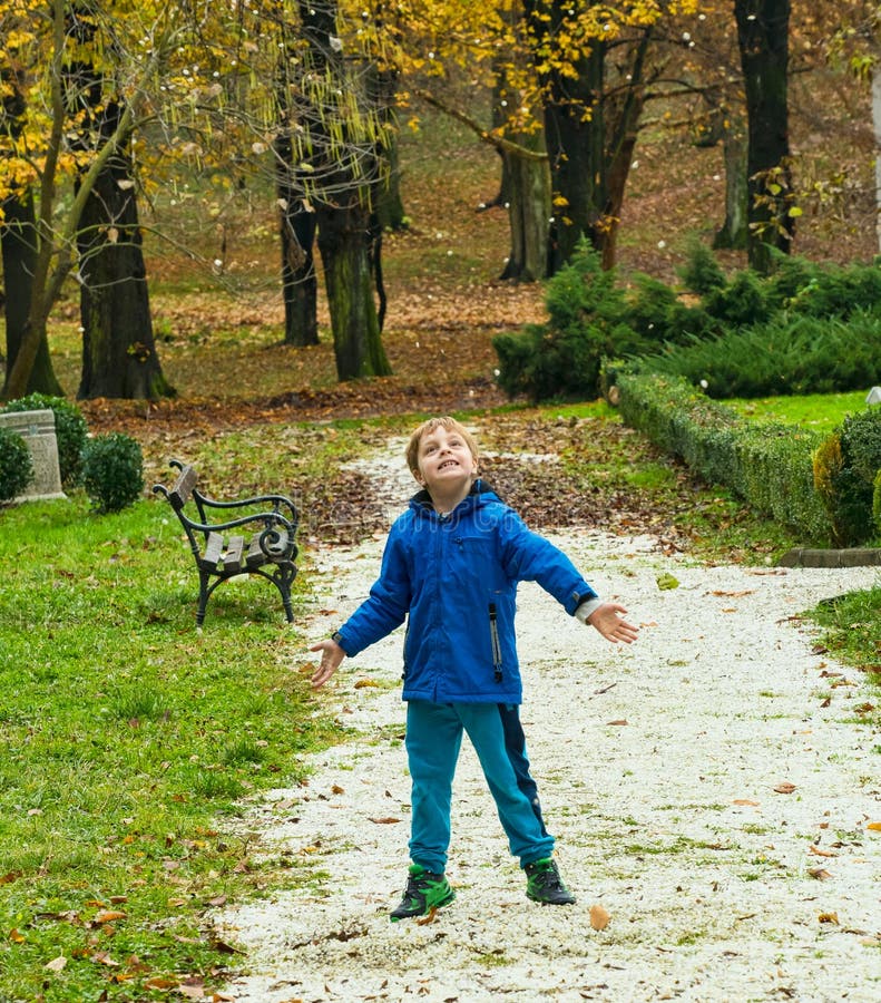 Boy throwing pebbles stock photo. Image of captured, outdoor - 81324536