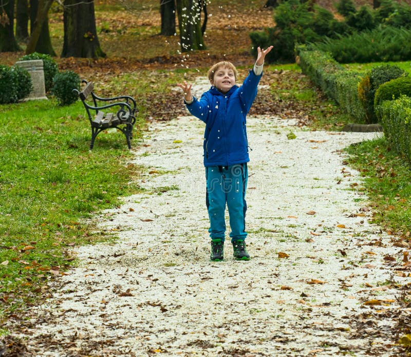 Boy throwing pebbles stock image. Image of play, enjoy - 81324797