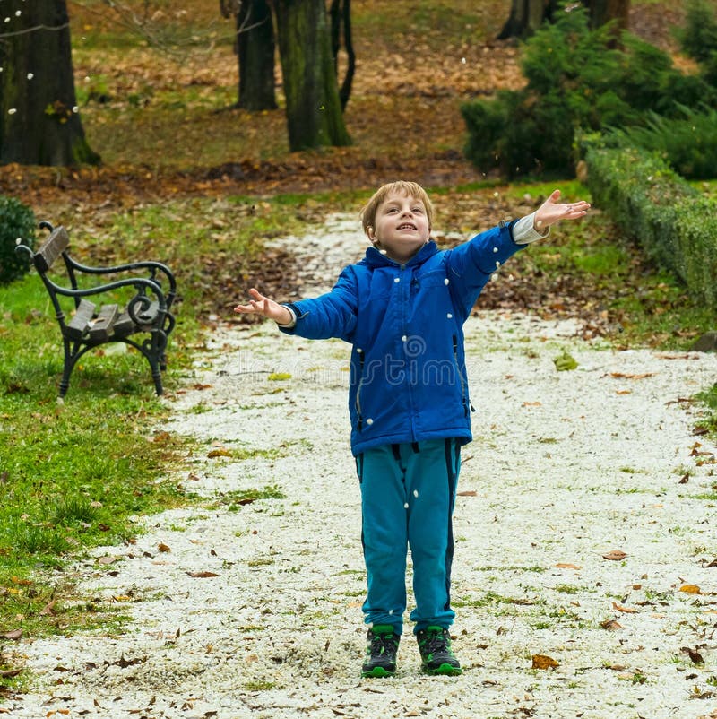 Boy throwing pebbles stock photo. Image of happiness - 81324462