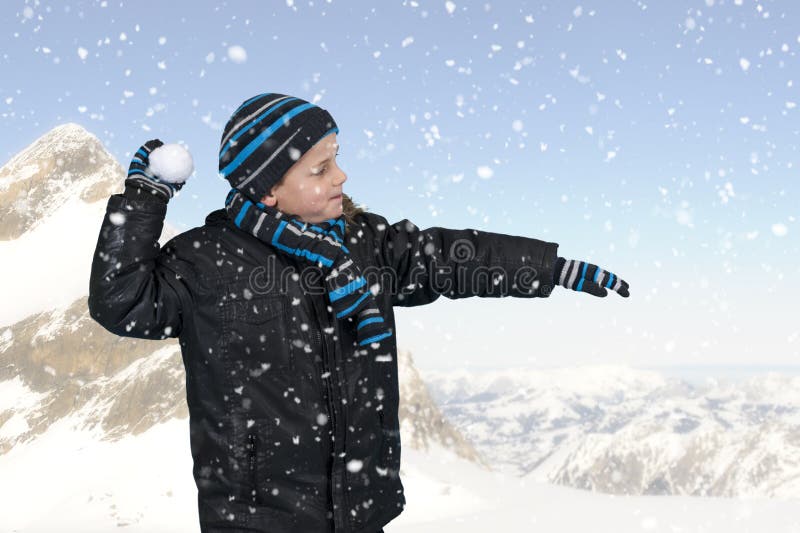 Boy Throwing a Snowball Outdoors in the Mountains Stock Photo - Image ...