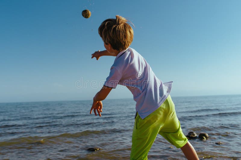Kid Throwing Stone in Water Stock Image - Image of motion, throwing ...