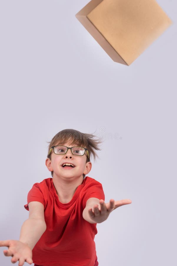 Boy Throws Box and Catches it. Photos in Motion Stock Photo - Image of ...