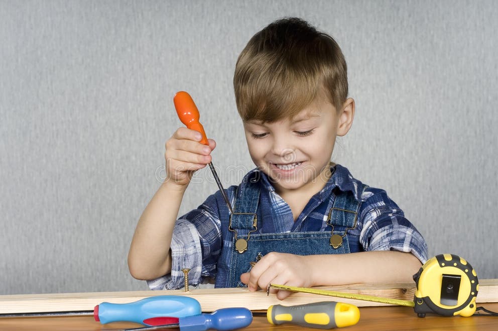 Boy with tools stock image. Image of childhood, cutting - 13236295