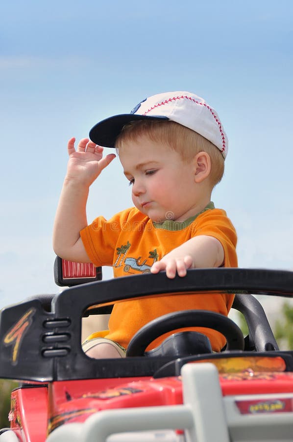 Little boy driving toy car stock photo. Image of steering - 8431154