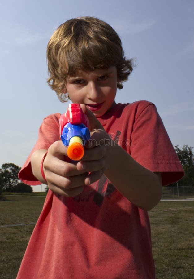 Boy with a toy gun stock image. Image of play, children - 25621711