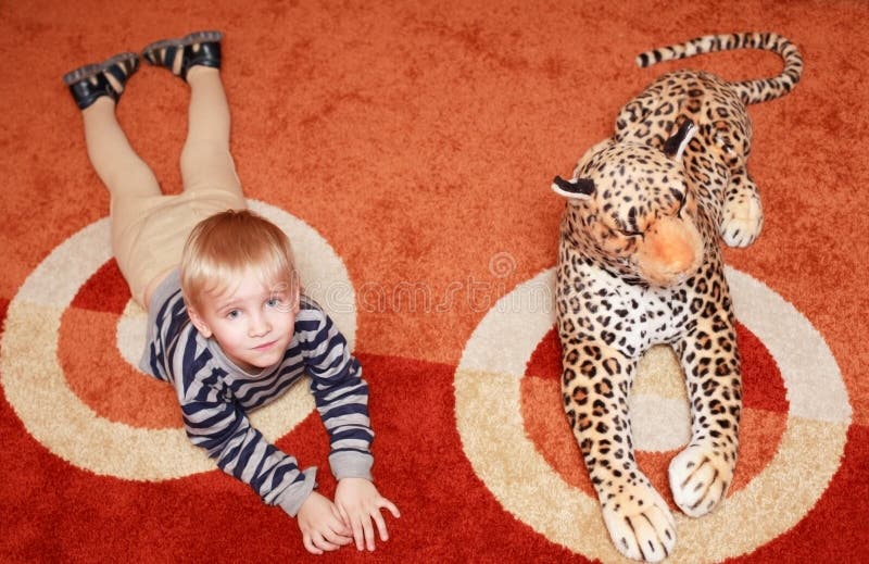 The Boy and Toy-leopard on the Carpet Stock Photo - Image of beast ...