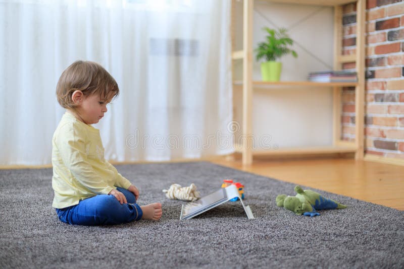 Boy and Toys with Tablet Computer Stock Image - Image of beige ...