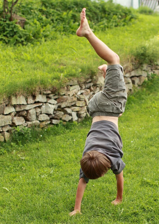 Boy training handstand stock photo. Image of standing - 26092412