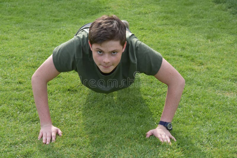 Boy Trains Push-ups Outside in the Garden Stock Image - Image of ...