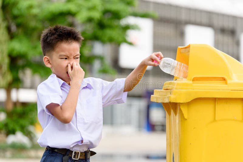 Boy trow the garbage stock image. Image of dress, children - 77419731