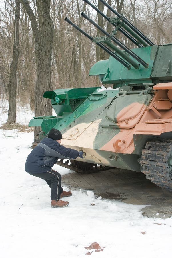 Boy try move the tank stock photo. Image of game, tank - 2051458