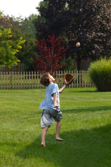 Boy Trying to Catch Ball stock photo. Image of children - 1244542