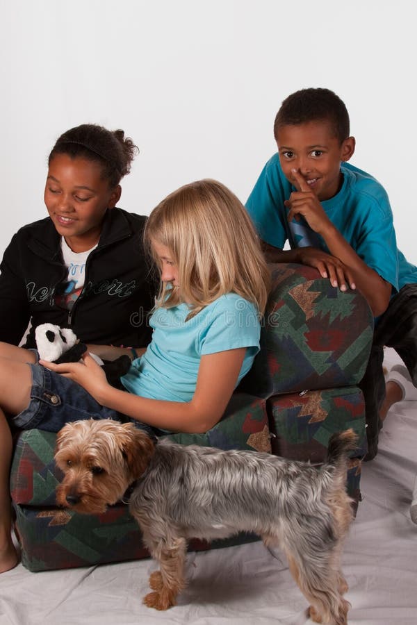 Boy Trying To Sneak Up on Sister and Firend Stock Image - Image of ...