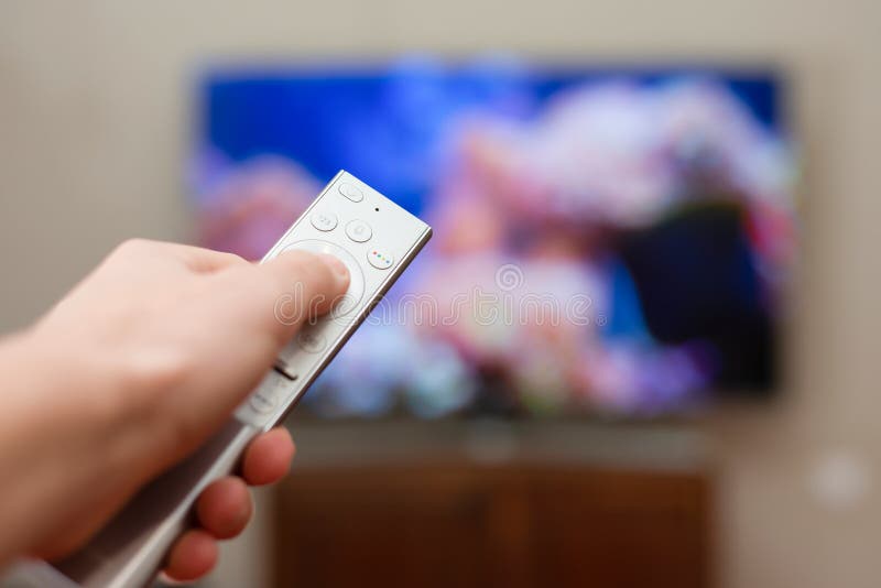 The Boy Turned on the Video on the TV through the Remote Control Stock ...