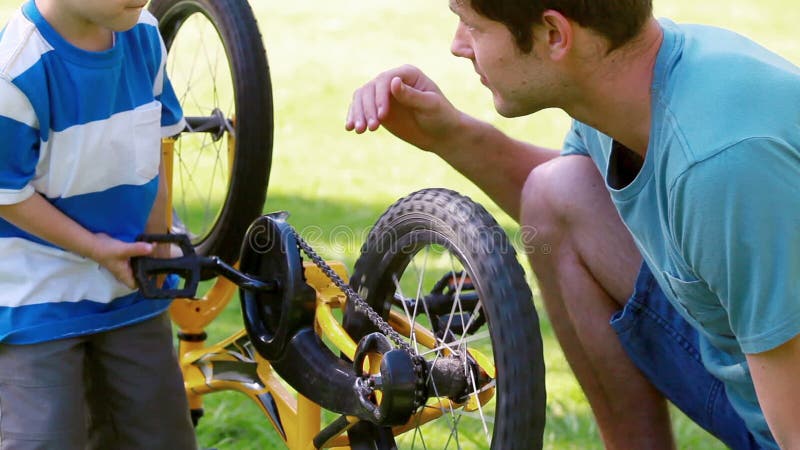 Father Turning Boy, Holding Legs at Stock Footage - Video of game ...