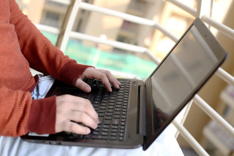 Boy is Typing on the Laptop Stock Photo - Image of dashing, pose: 135157778