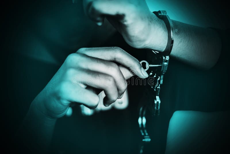 Boy Unlocking Handcuffs that Bind Him Stock Image - Image of bondage ...