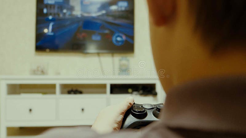 Boy Using a Controller To Play a Video-game Stock Image - Image of ...