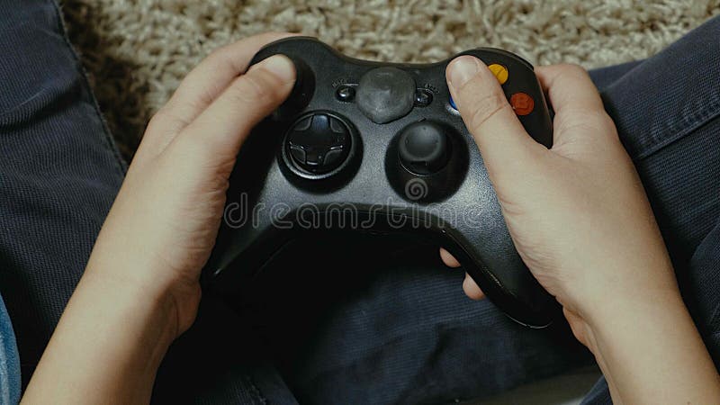 Boy Using a Controller To Play a Video-game Stock Image - Image of ...
