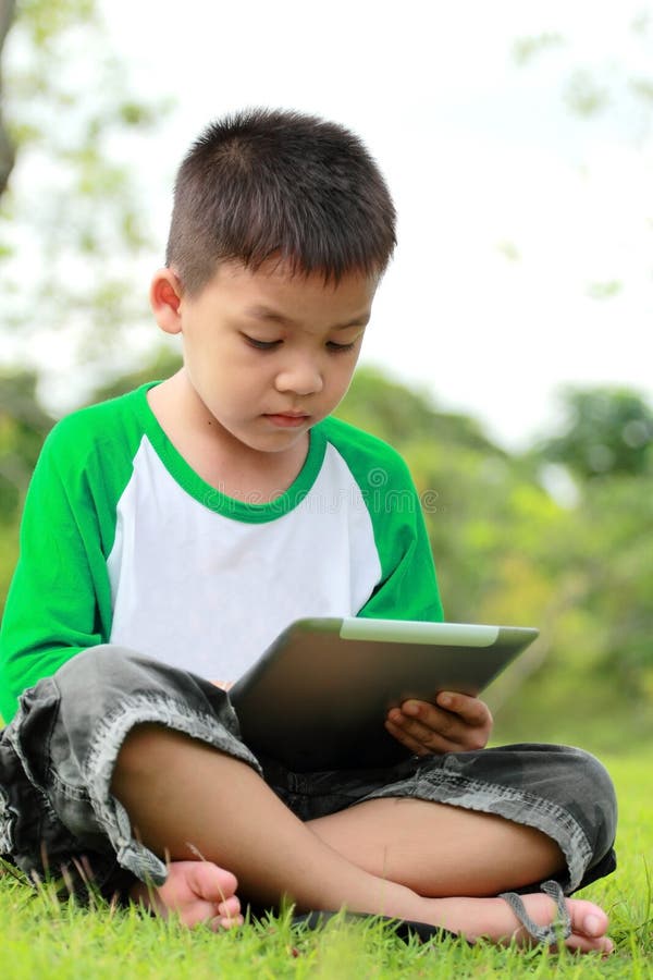 Boy using digital tablet stock image. Image of child - 25750797