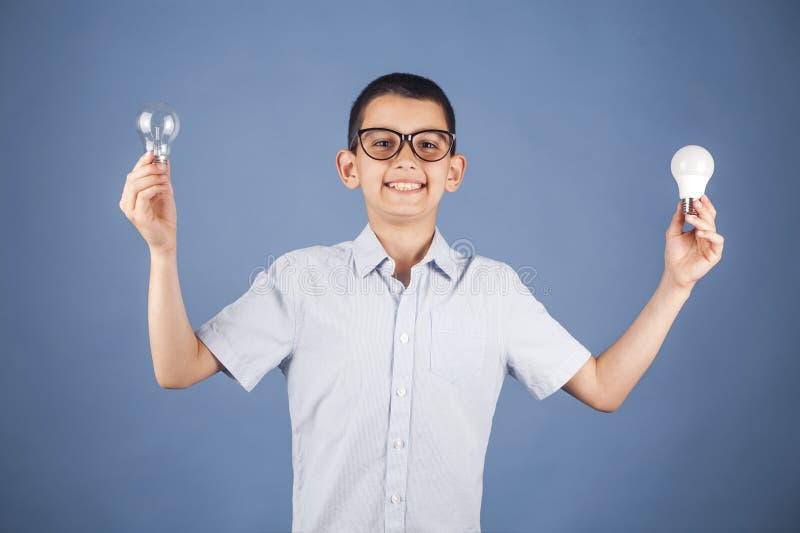 Boy Using an Energy-saving and Incandescent Lamp. Energy Efficiency ...