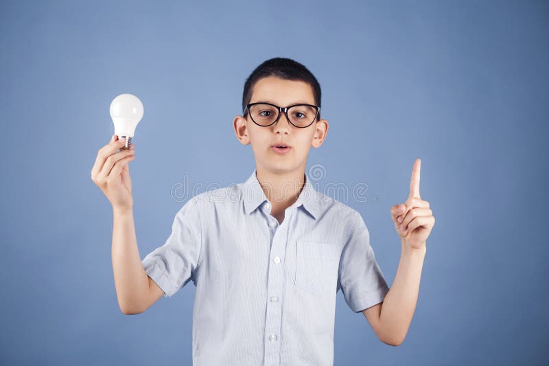 Boy Using an Energy-saving Lamp. Energy Efficiency Concept Stock Image ...