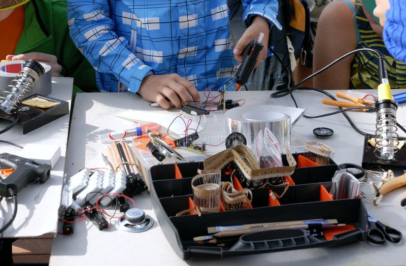 Boy is Using Glue Gun To Make Different Things. Stock Photo - Image of ...